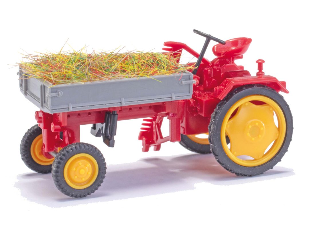 Tractor RS09 with flat bed and hay load - E-trains