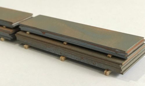 Two Stacks of Steel Plates with Lashing Chains - e-Trains